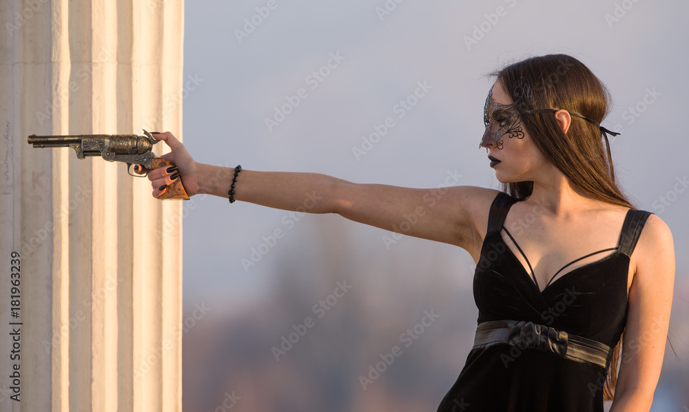 girl killer with vintage pistol, woman in mask Stock Photo | Adobe Stock
