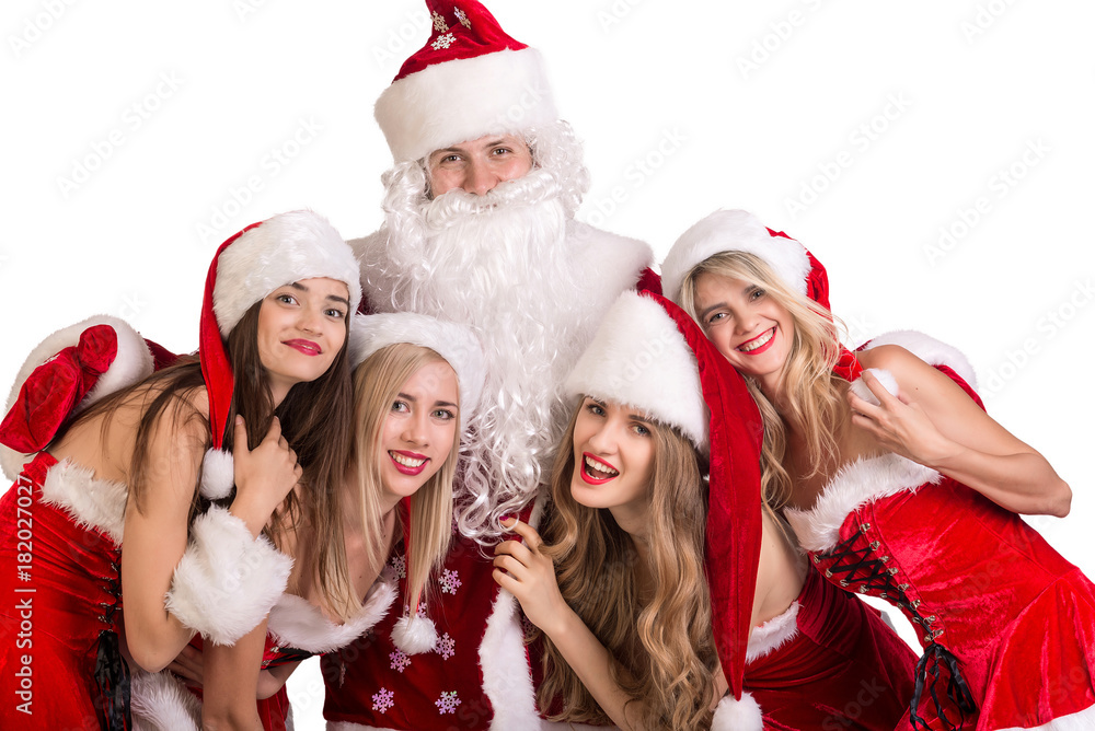 Santa Claus And Four Santas Helpers In Red Christmas Costumes