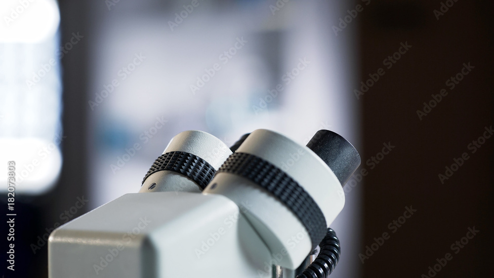 Professional microscope standing in laboratory, medical research ...