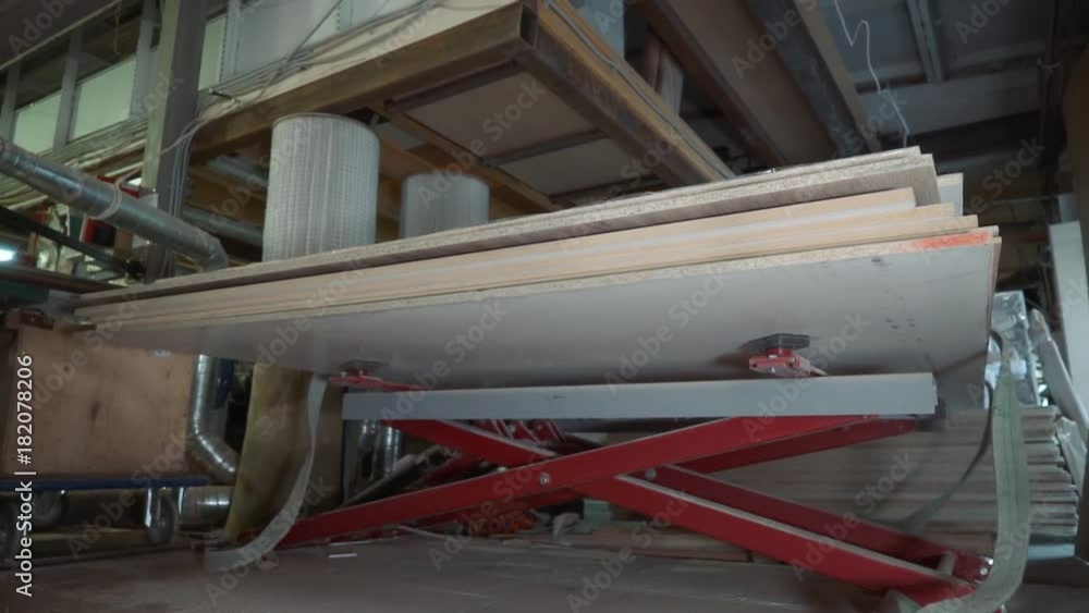 manufacture of case furniture. The process of loading the chipboard by ...