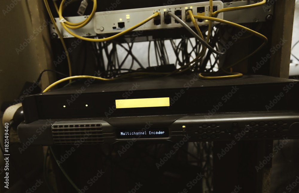 Fiber Optic cables connected to an optic ports and Network cables ...