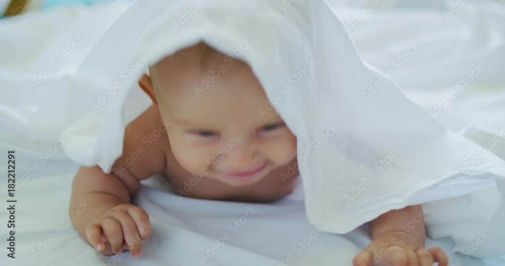 Cute happy little baby laughing and playing Stock Video | Adobe Stock