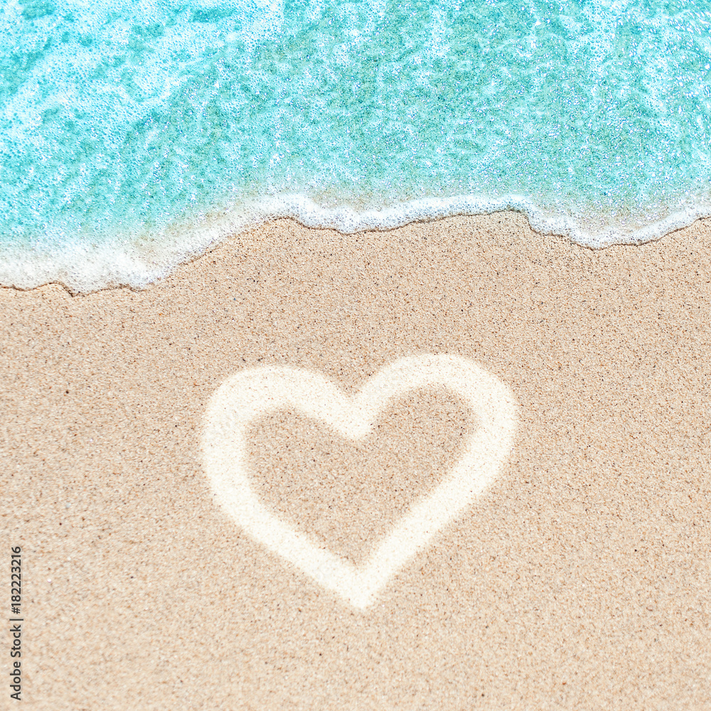 Sea Beach and Sand in summer day with love heart shape sign on sand ...