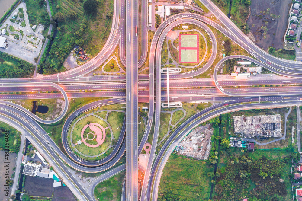 Aerial view of urbal highway intersection road with green exercise ...