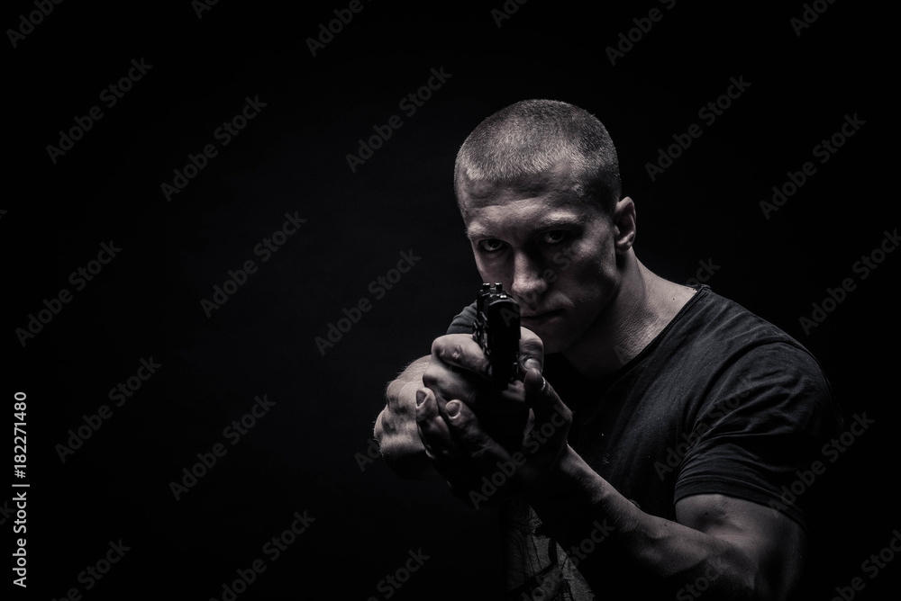 portrait of a handsome male bodybuilder, on a black background isolated ...
