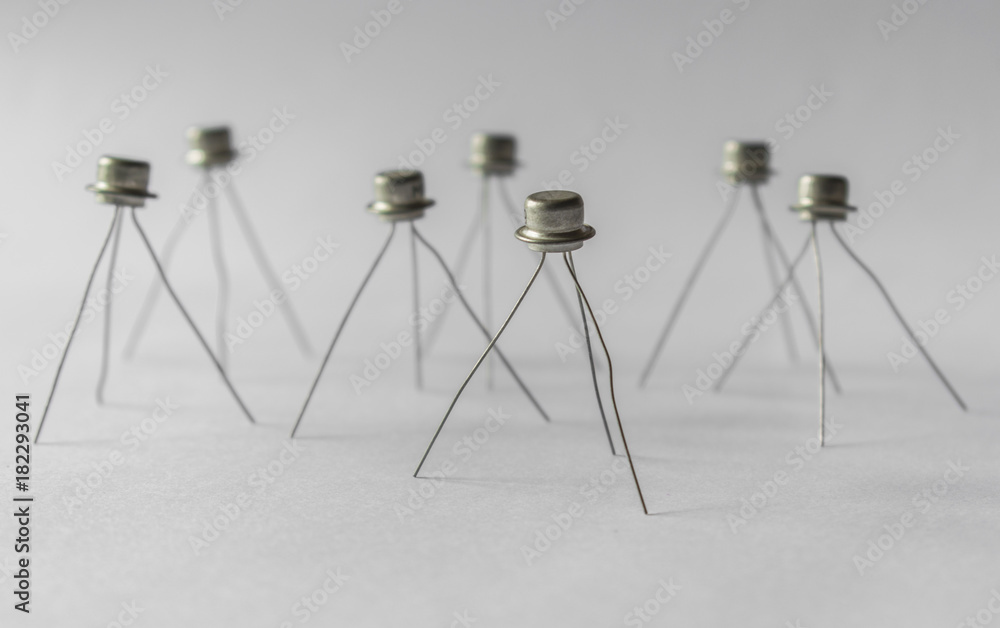 Transistors stand on legs. Stock Photo | Adobe Stock