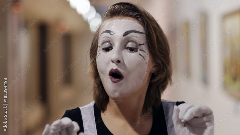 mime with a white make-up on her face shows different emotions Stock ...