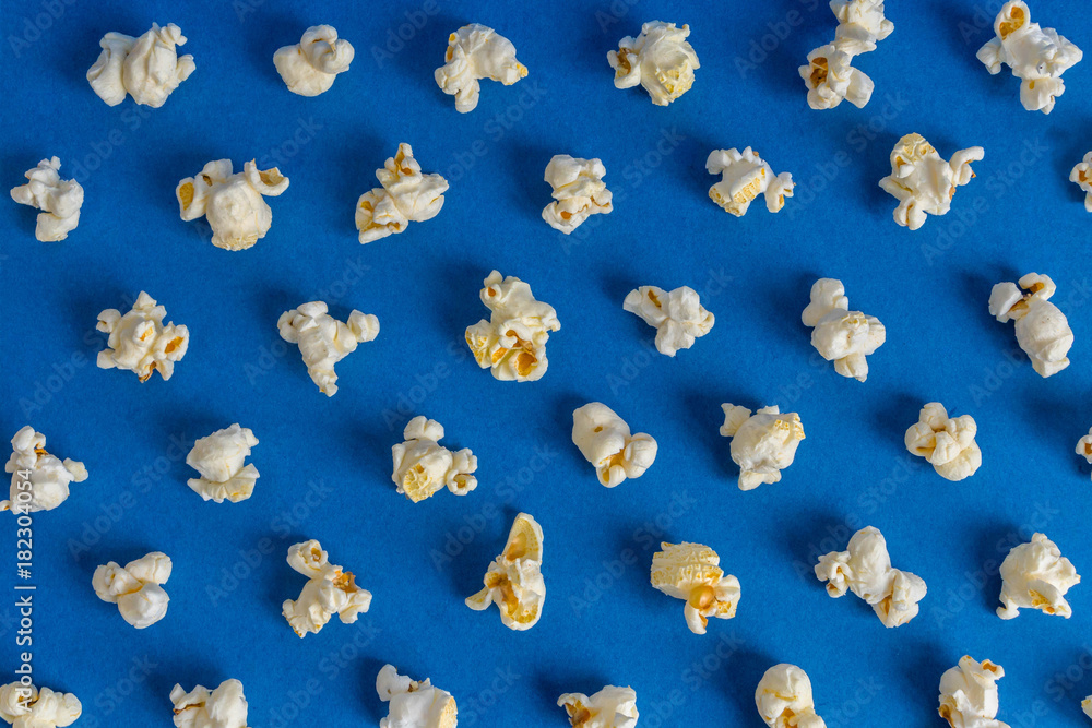 Popcorn on a blue background. Top view. Stock Photo | Adobe Stock