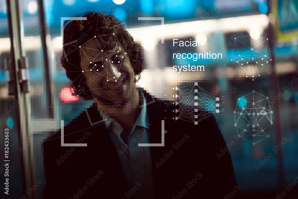 Facial recognition system, concept. Young man on the street, face ...
