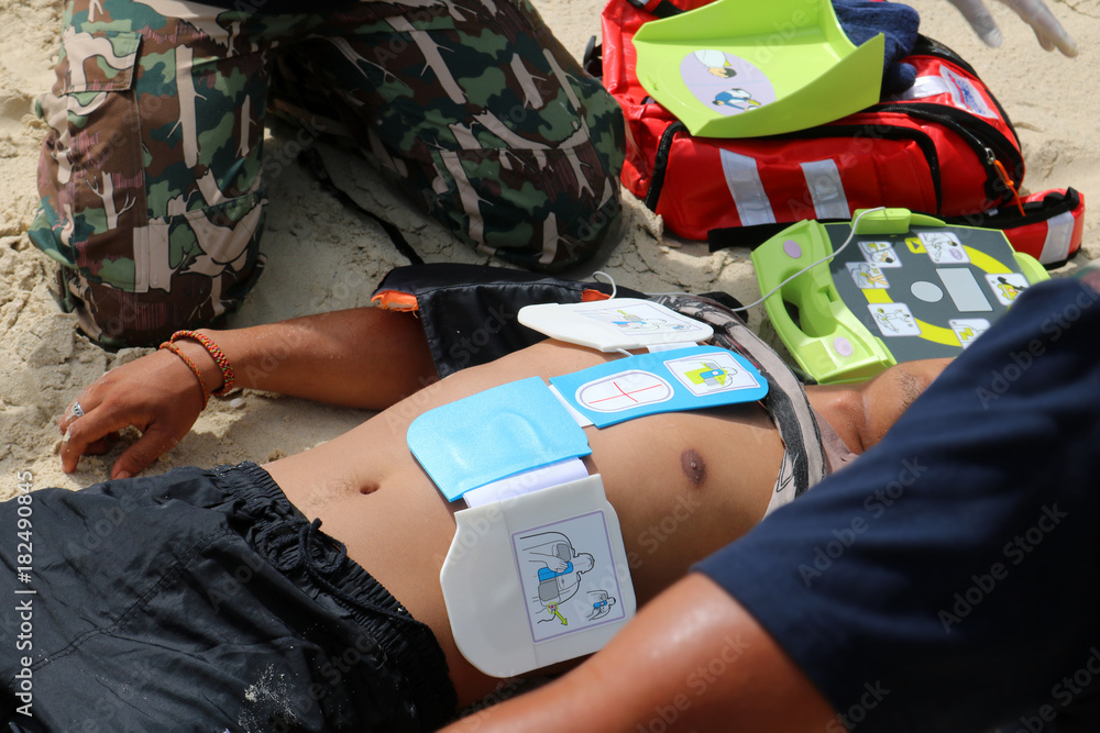 CPR and AED on the beach, Training for Rescue and first aid Stock Photo ...