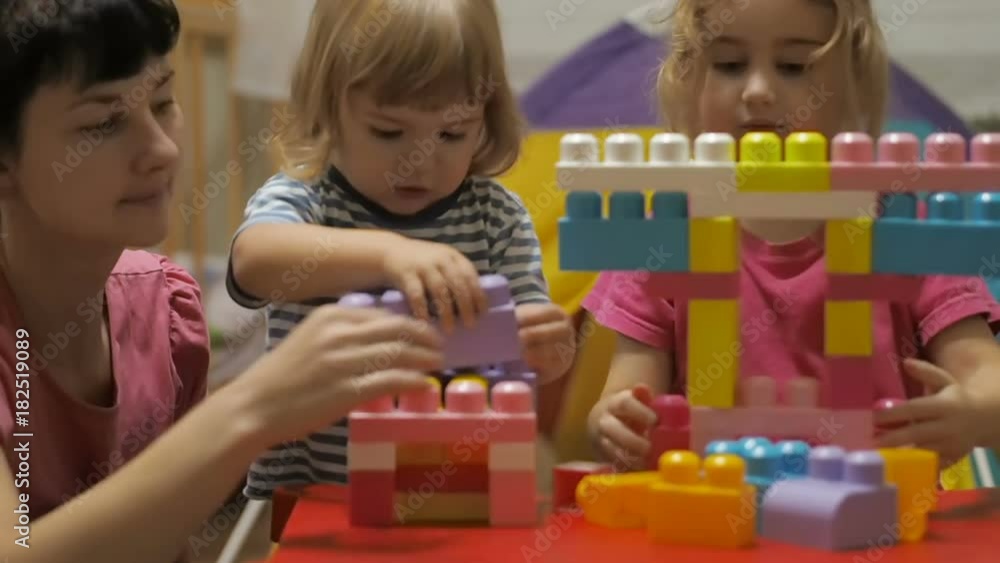Boy and Girl Build Toy. Children Kid and Baby Play With Blocks ...