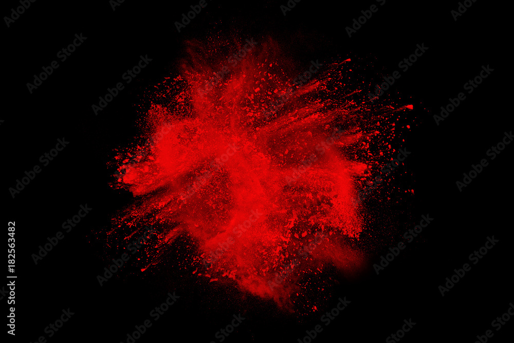 Abstract explosion of red dust on black background. Abstract red powder ...