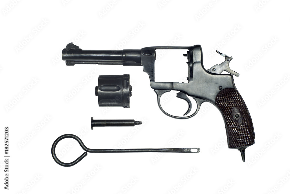 dismantled vintage revolver with the cylinder removed and the ramrod in ...