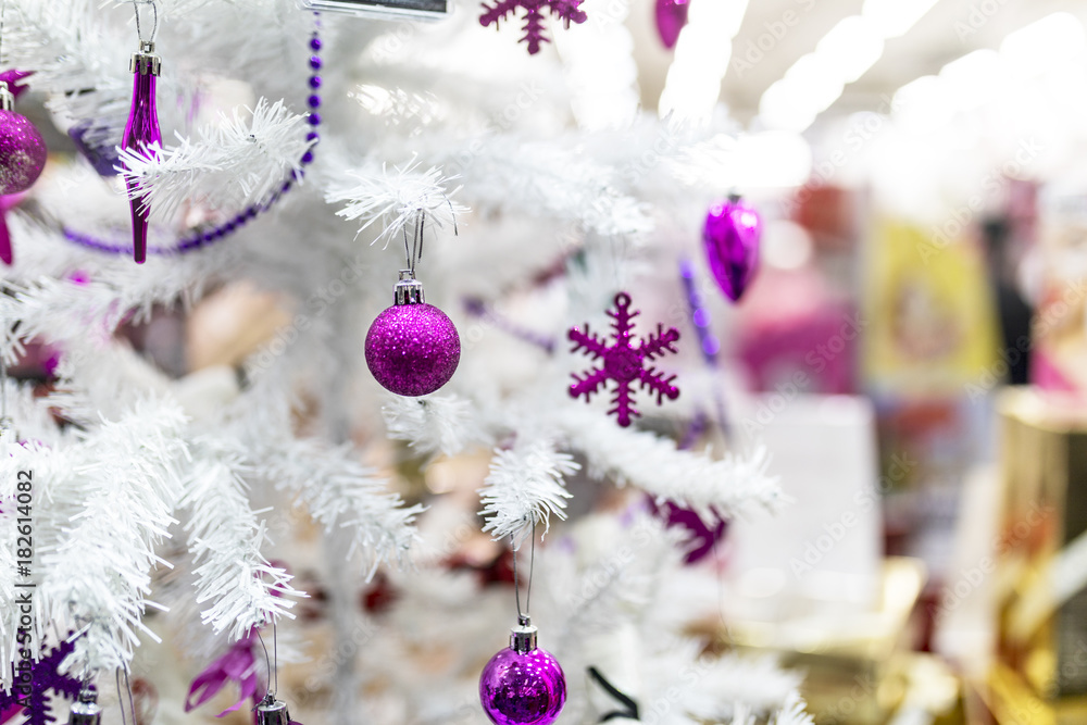 White Christmas Tree With Purple Decorations