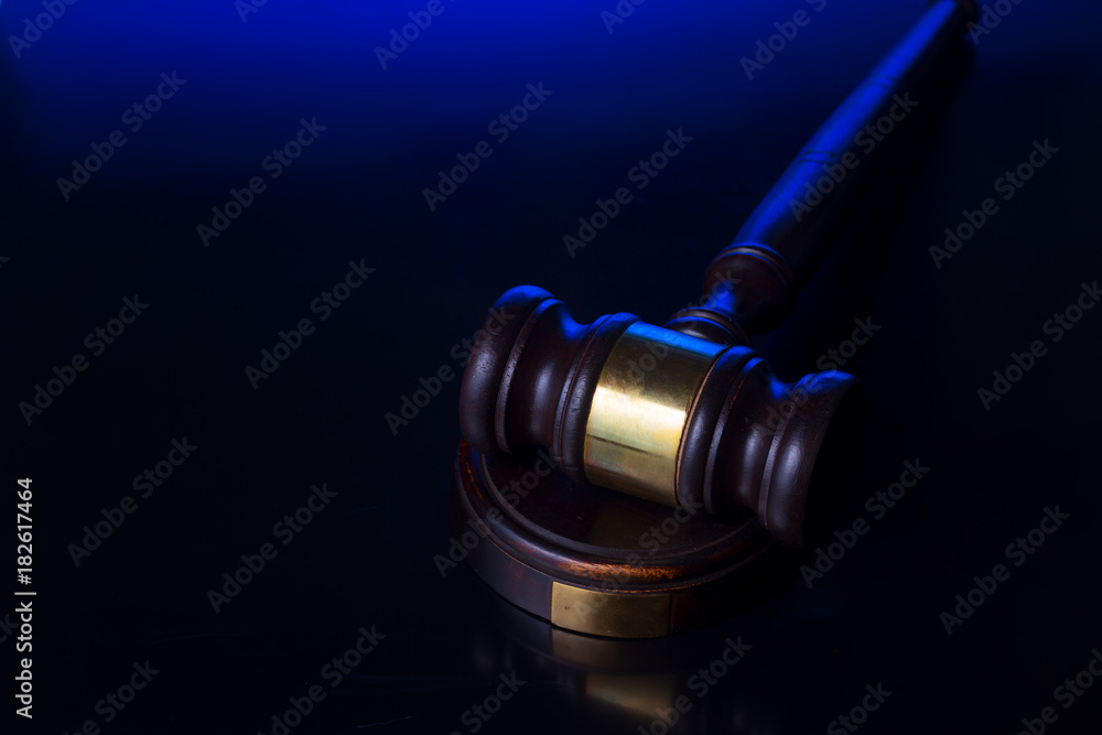Law and justice concept - wooden law gavel pn blue and black background ...