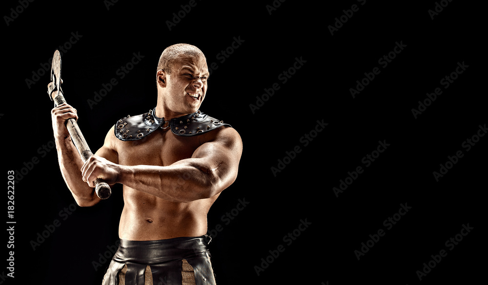 Severe barbarian in leather costume with axe. Studio shot. Black ...