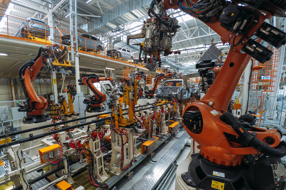 Automobile plant, welding process, modern production of cars, robot ...