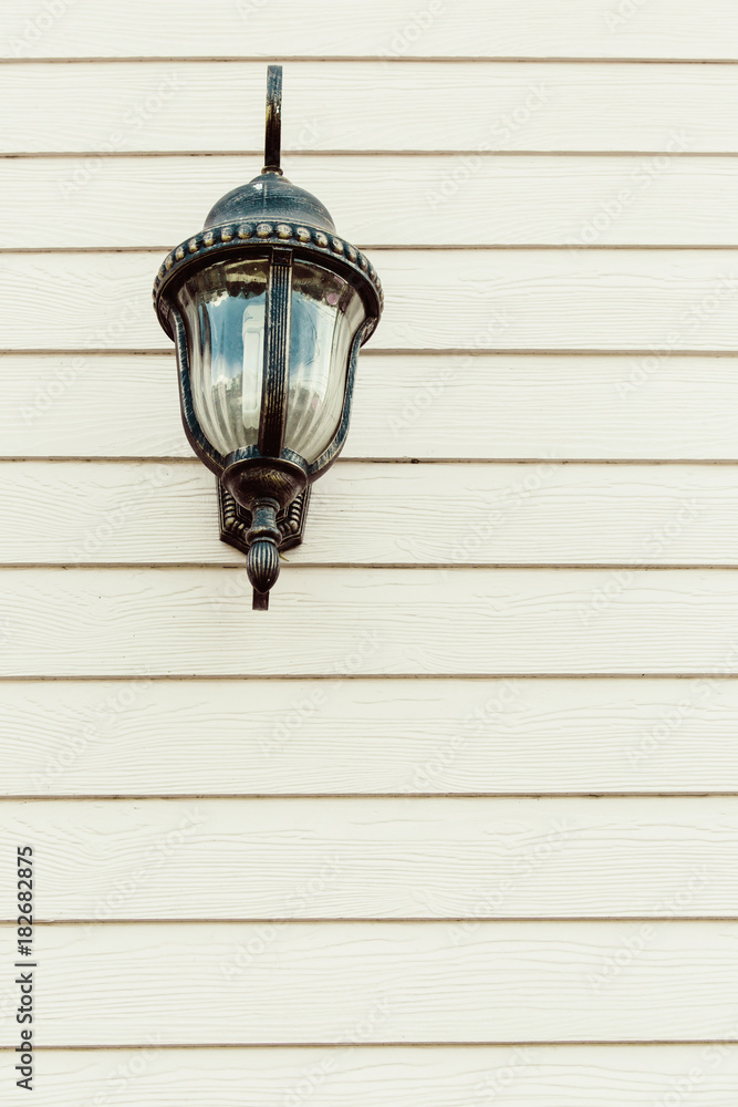 House lamp post on siding wall Stock Photo | Adobe Stock
