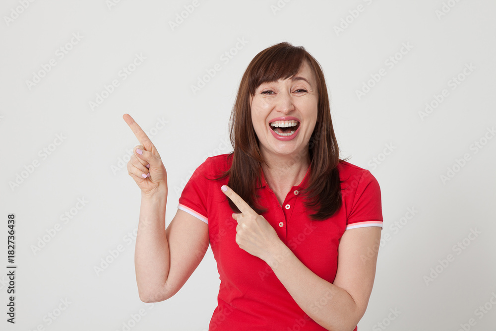 Laughing middle aged woman showing something by her fingers isolated on ...