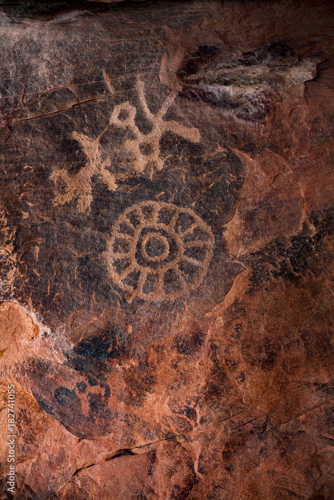 Beautiful ancient petroglyphs carved into a red rock Stock Photo ...