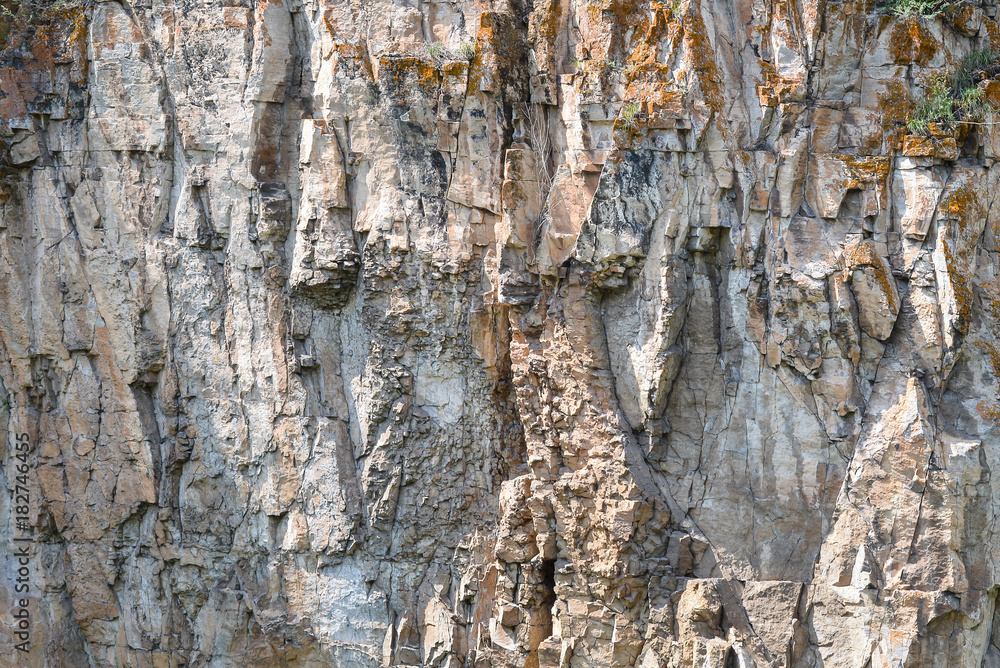 Detail closeup of a mountain rock wall, background or wallpaper of ...