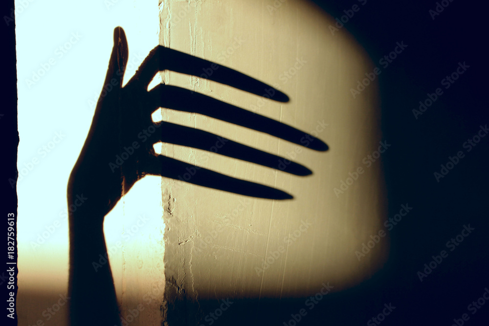 Black Shadow Of A Big Hand On The Wall. Silhouette Of A Hand On The ...
