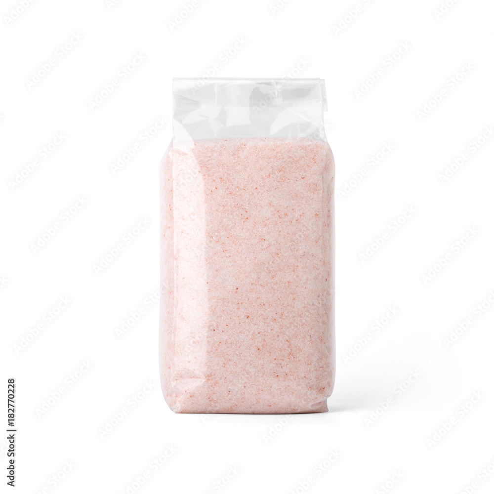 Pink salt in transparent plastic bag isolated on white background ...