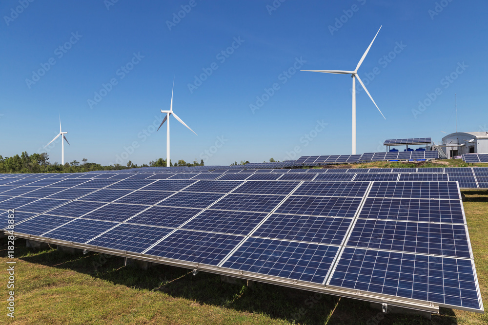 Solar panels and wind turbines generating electricity is solar energy ...