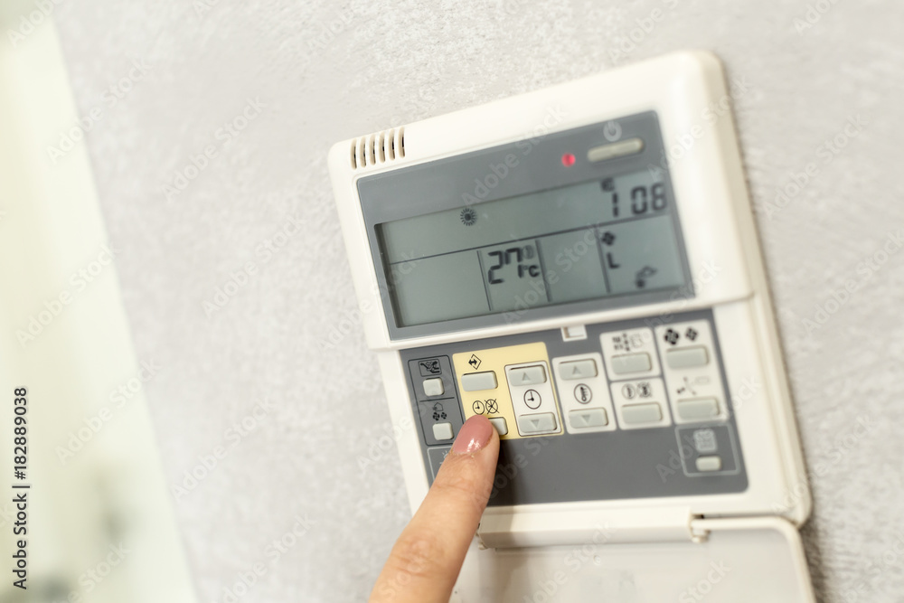 Air Conditioner Remote Control in a hotel room Stock Photo | Adobe Stock