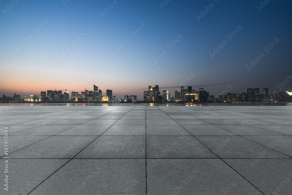 night view of empty brick floor front of modern building Stock Photo ...