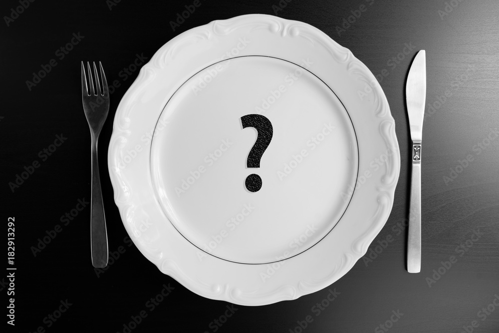 What to eat concept. Top view empty white plate on black background ...