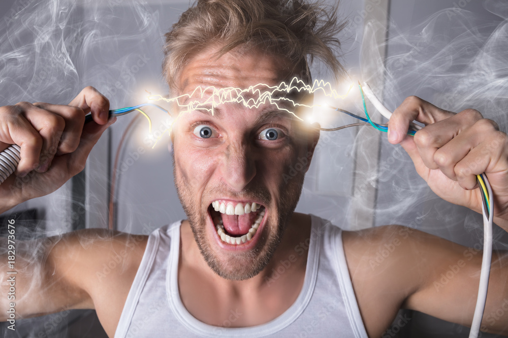 Man Holding Bared Wires Stock Photo | Adobe Stock