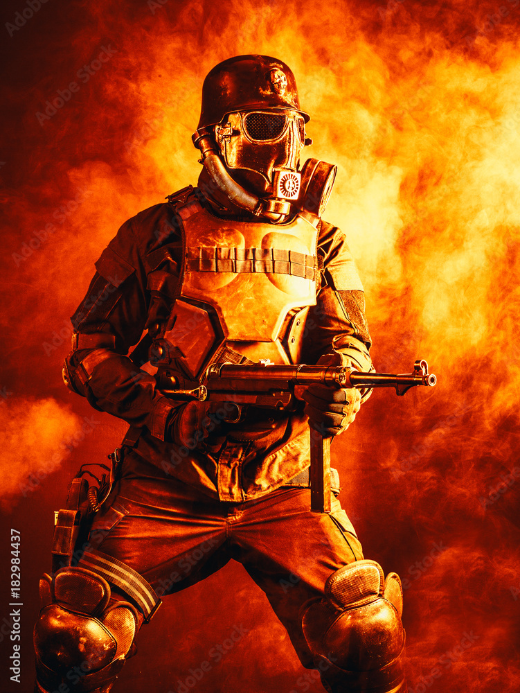 Futuristic nazi soldier in fire and smoke gas mask and steel helmet ...