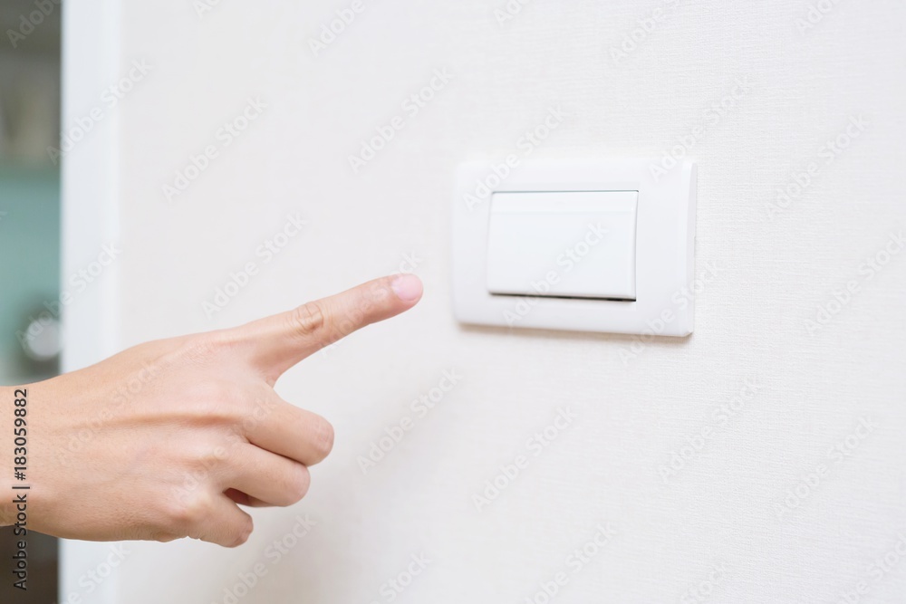 Turn off the light, close up man hand is closing the power switch. Save ...