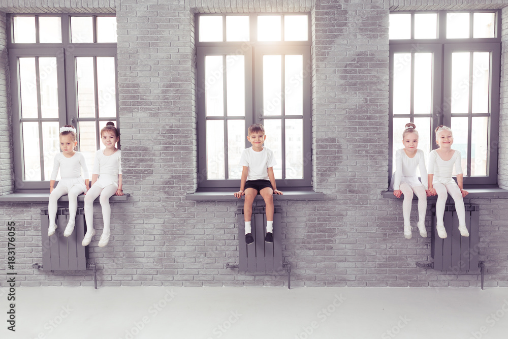 Cute little kids dancers on white background. Choreographed dance by a ...