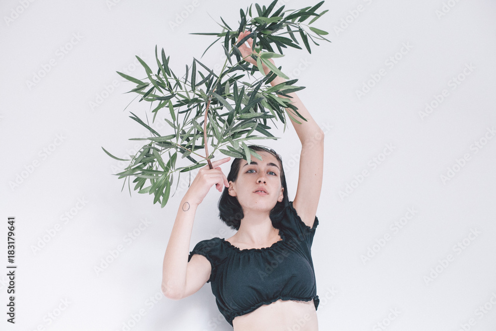 girl holds a branch of olive tree on white background Stock Photo ...