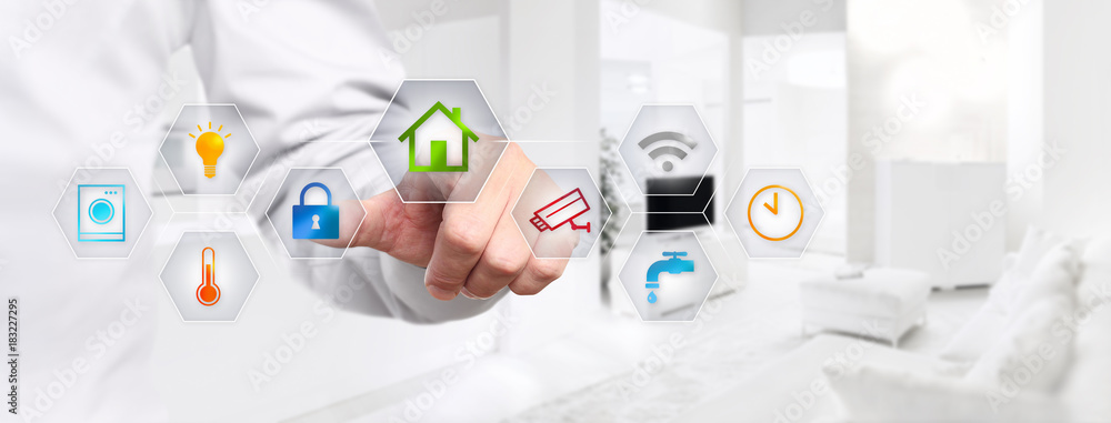 smart home automation hand touch screen with colored symbols on ...