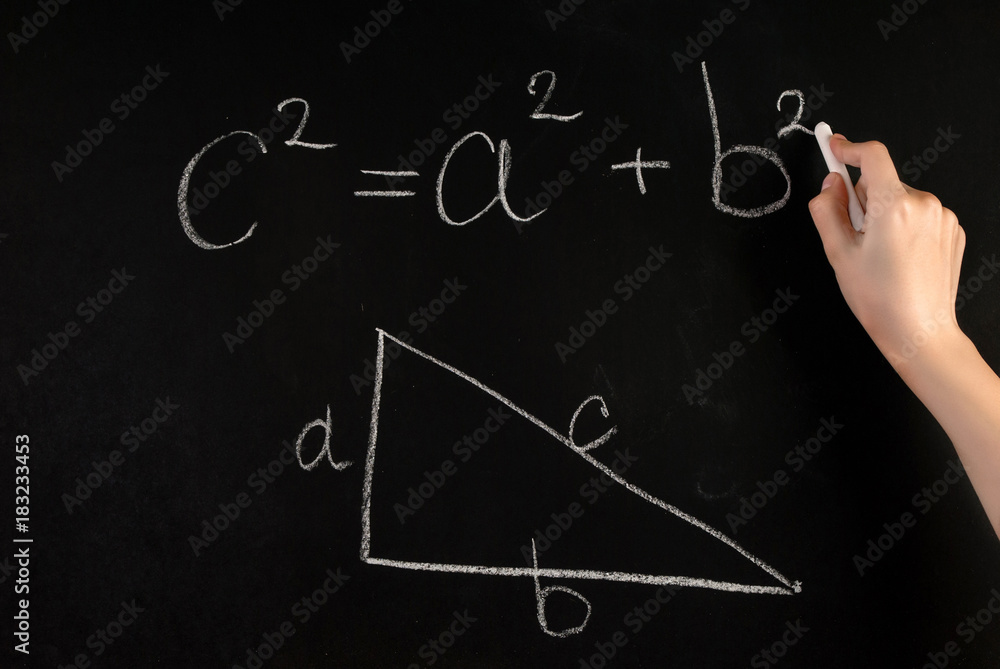 Girl hand write Pythagoras Theorem and angled triangle with on school ...