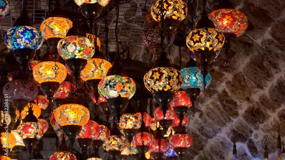 Zoom in to many colourful colorful arabic style lights hanging under ...