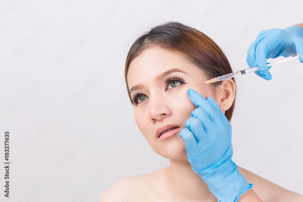 Beauty treatment concept : Female Doctors hands in gloves making an ...