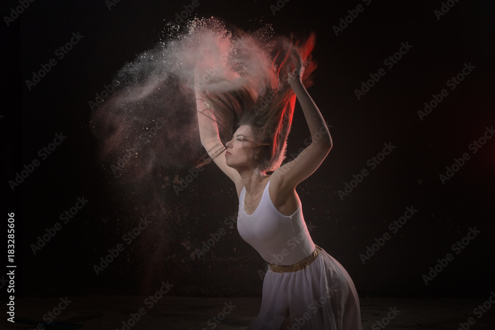 Beautiful slim female dancer in studio during Powder Photo Shoot with ...