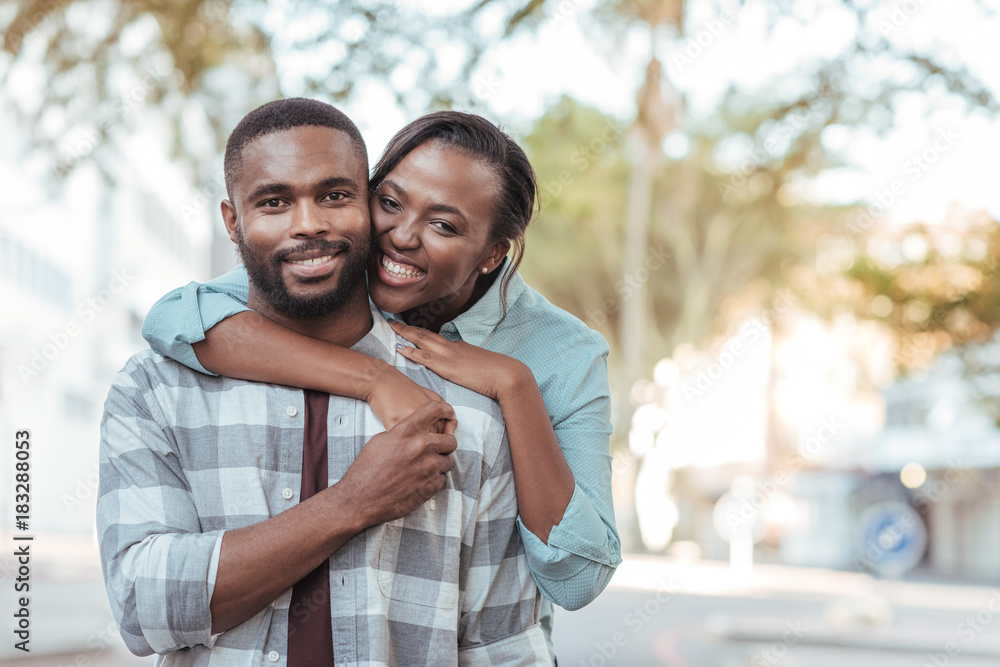 Content African couple standing together outside on a sunny day Stock ...