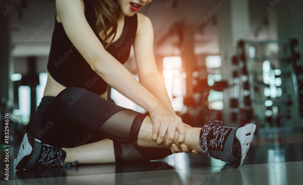 Woman doing sport exercise injury leg accident at gym fitness Stock ...