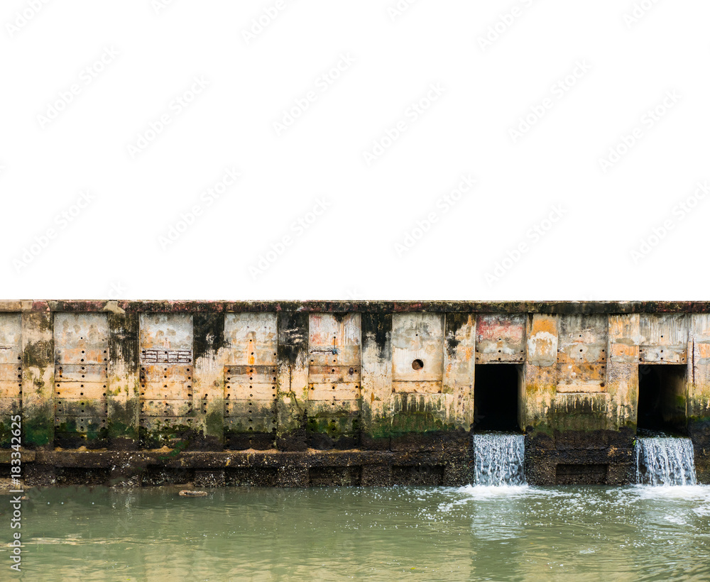 Water from a canal in the city is dropping down to the sea. To drain ...