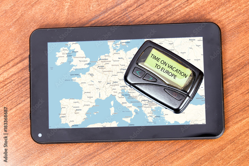 Old pager with the inscription "TIME ON VACATION. TO EUROPE". Tablet ...