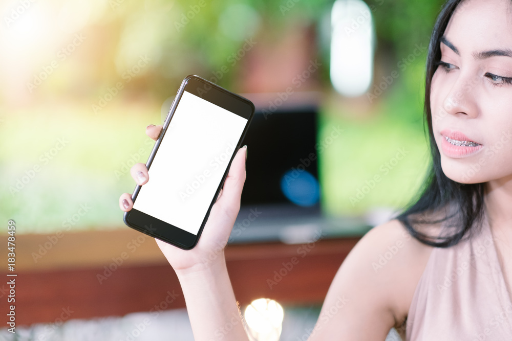 Mockup image of a beautiful woman holding and showing white mobile ...