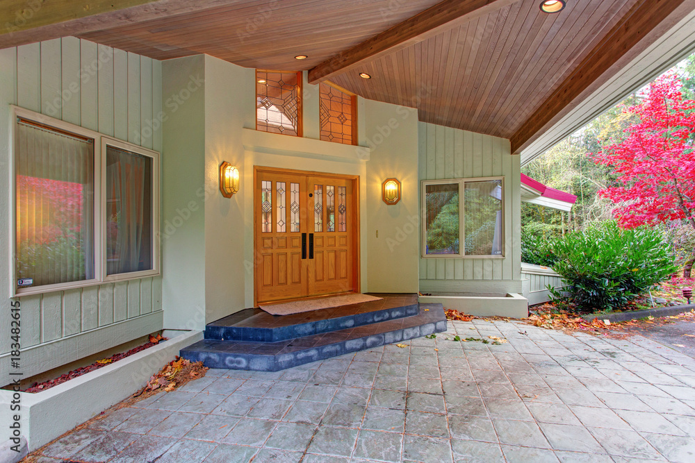 Gorgeous front porch with blue stairs Stock Photo | Adobe Stock