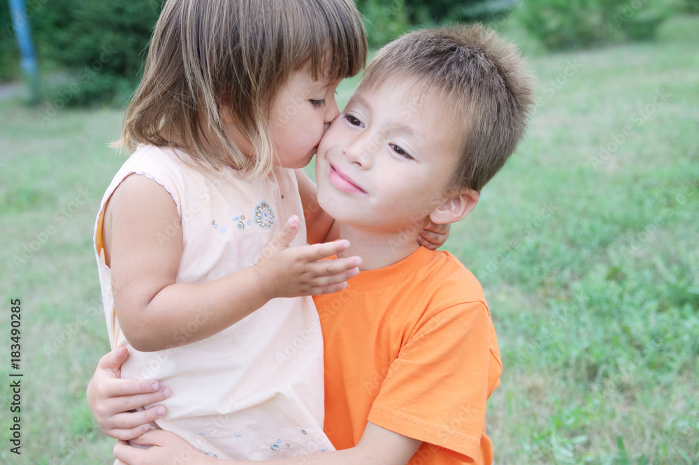 little girl kissing boy, happy siblings childhood ภาพถ่ายสต็อก | Adobe ...
