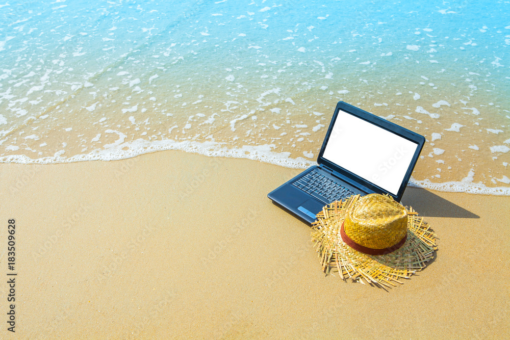laptop or computer notebook on sea beach and wave - business travel ...
