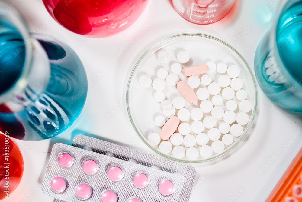 pills and test tubes in laboratory. drug discovery, pharmacology and ...